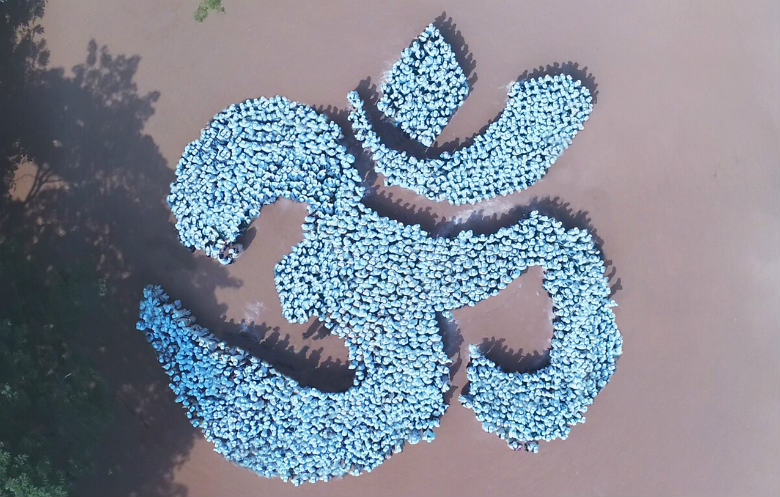 Largest human image of an om symbol | Guinness World Records